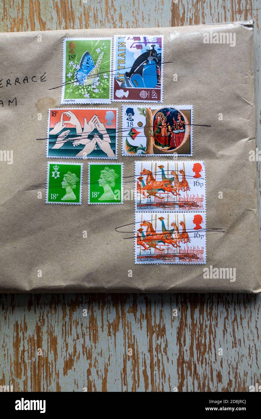 Mad collection of low value stamps on a brown envelope Stock Photo - Alamy