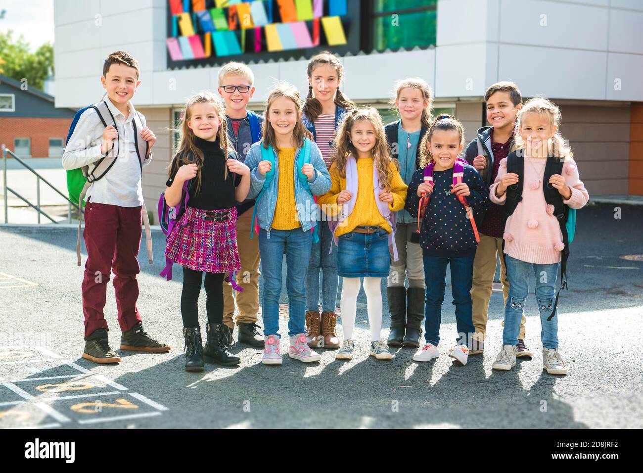 group of kids on the school background having fun Stock Photo - Alamy