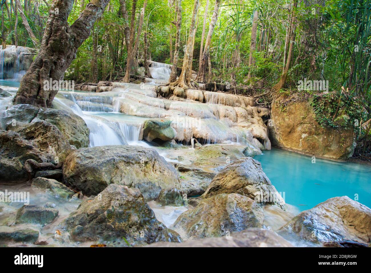 Erawan waterfall, amazing blue water cascades through the jungle at one ...
