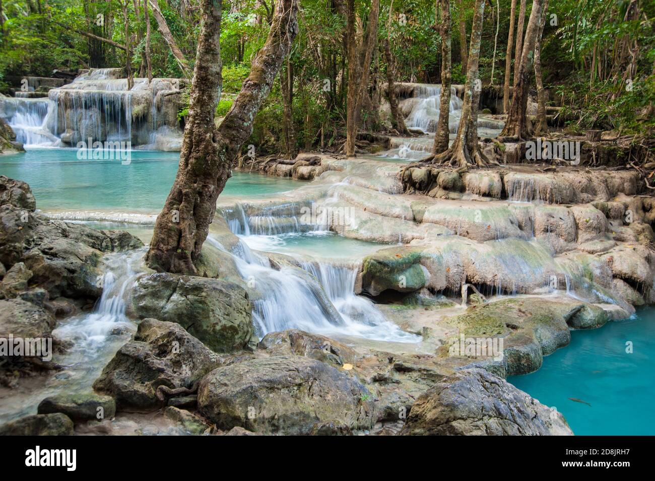 Erawan waterfall, amazing blue water cascades through the jungle at one ...