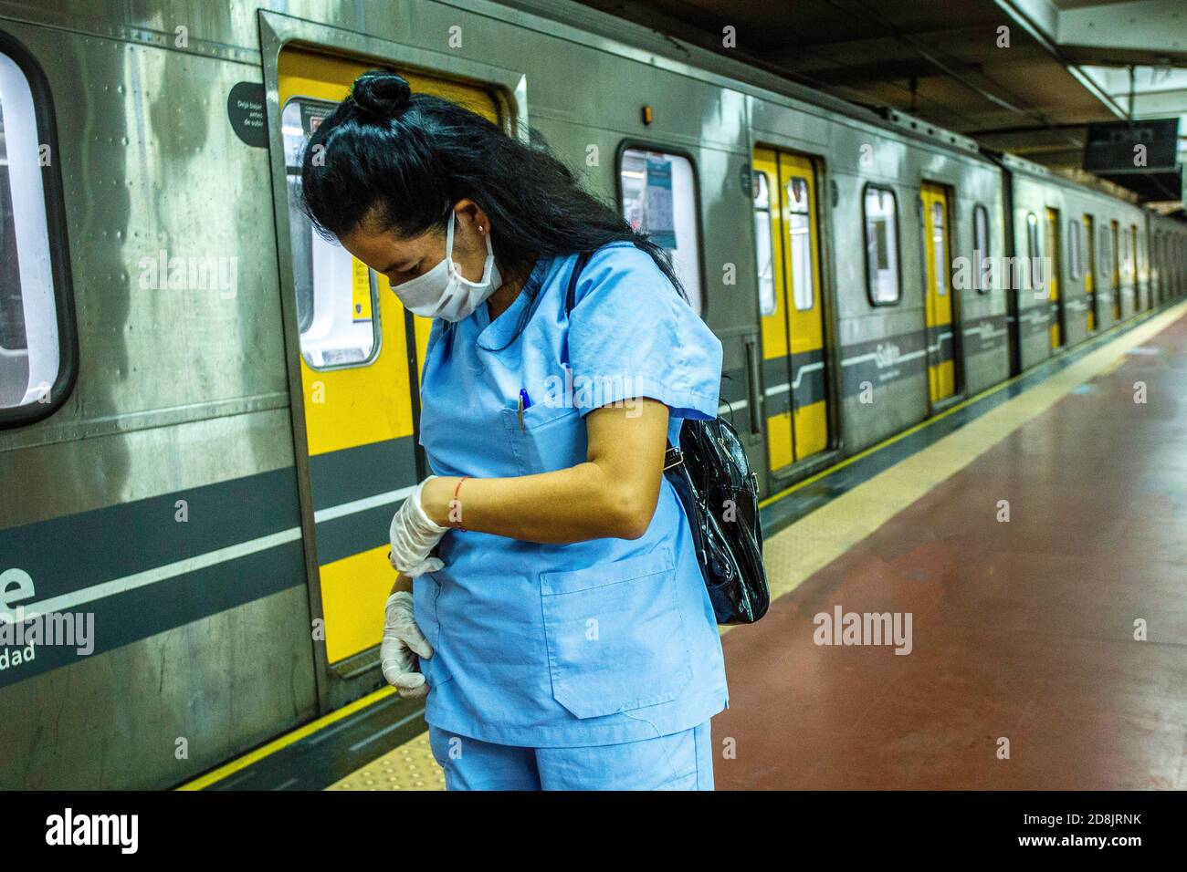 portrait brunette nurse in public transport, subway Stock Photo - Alamy