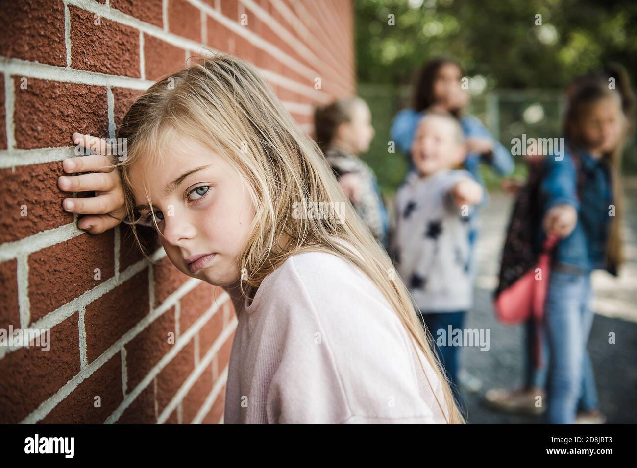 sad intimidation moment Elementary Age Bullying in Schoolyard Stock ...