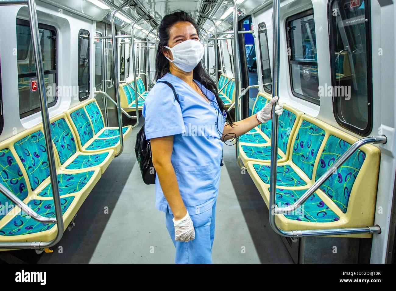 portrait brunette nurse in public transport smiling Stock Photo - Alamy