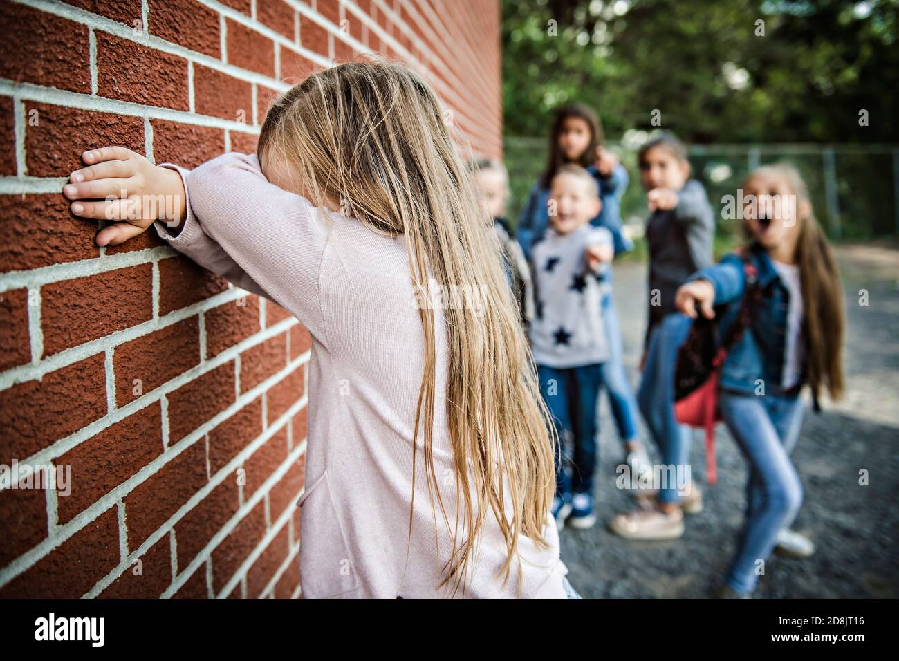 sad intimidation moment Elementary Age Bullying in Schoolyard Stock ...