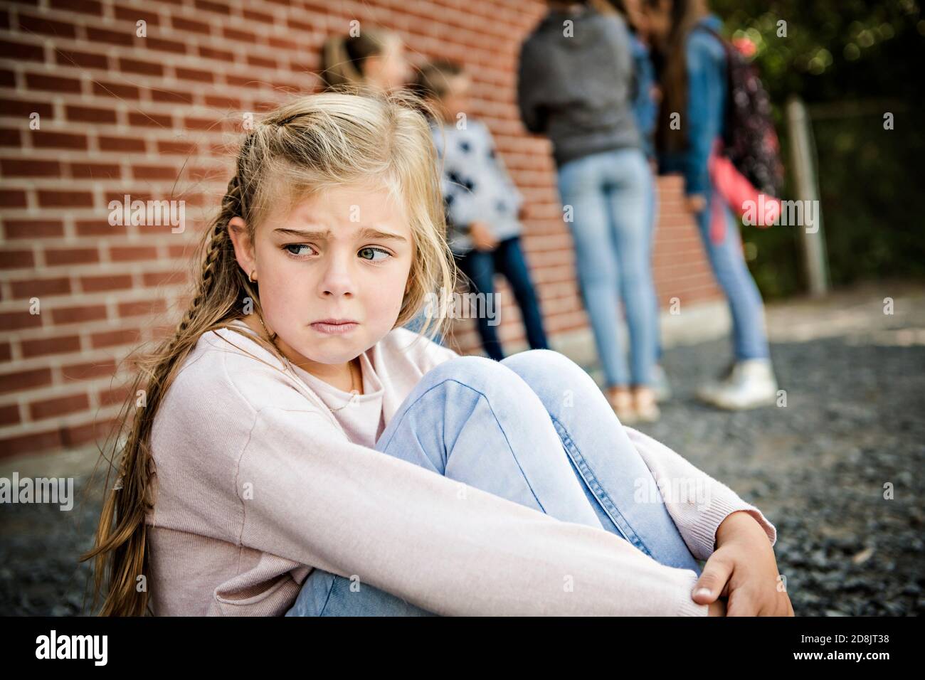 sad intimidation moment Elementary Age Bullying in Schoolyard Stock ...