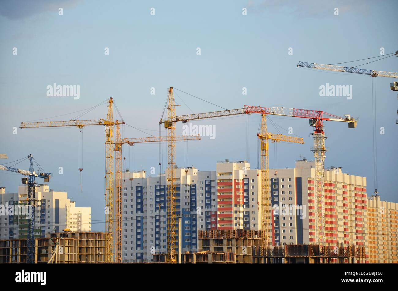 Inside place for many tall buildings under construction and cranes ...