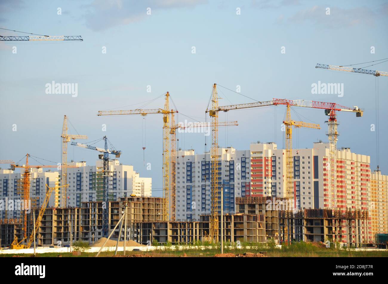 Inside place for many tall buildings under construction and cranes ...