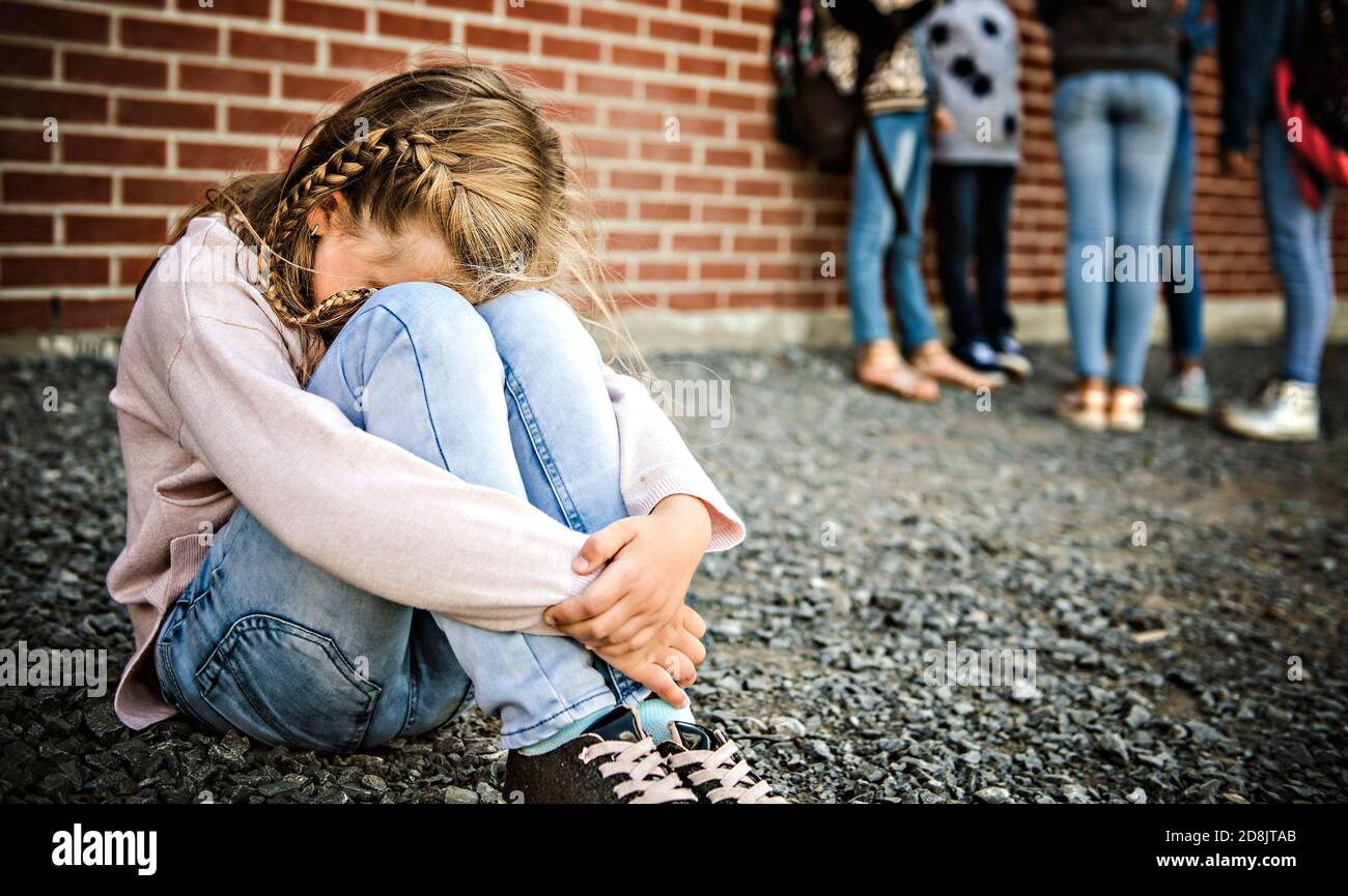 sad intimidation moment Elementary Age Bullying in Schoolyard Stock ...
