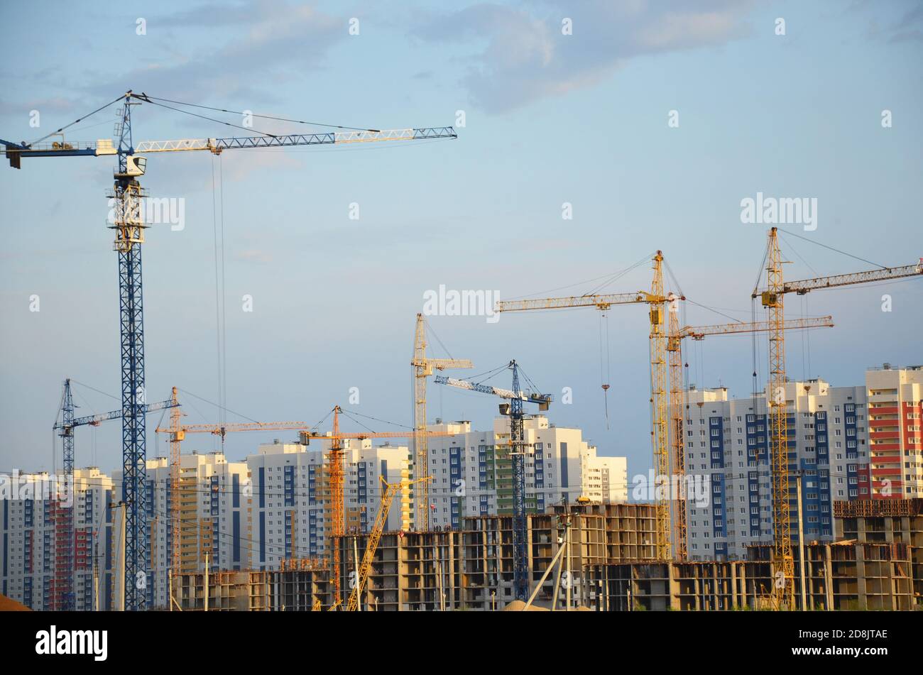 Inside place for many tall buildings under construction and cranes ...