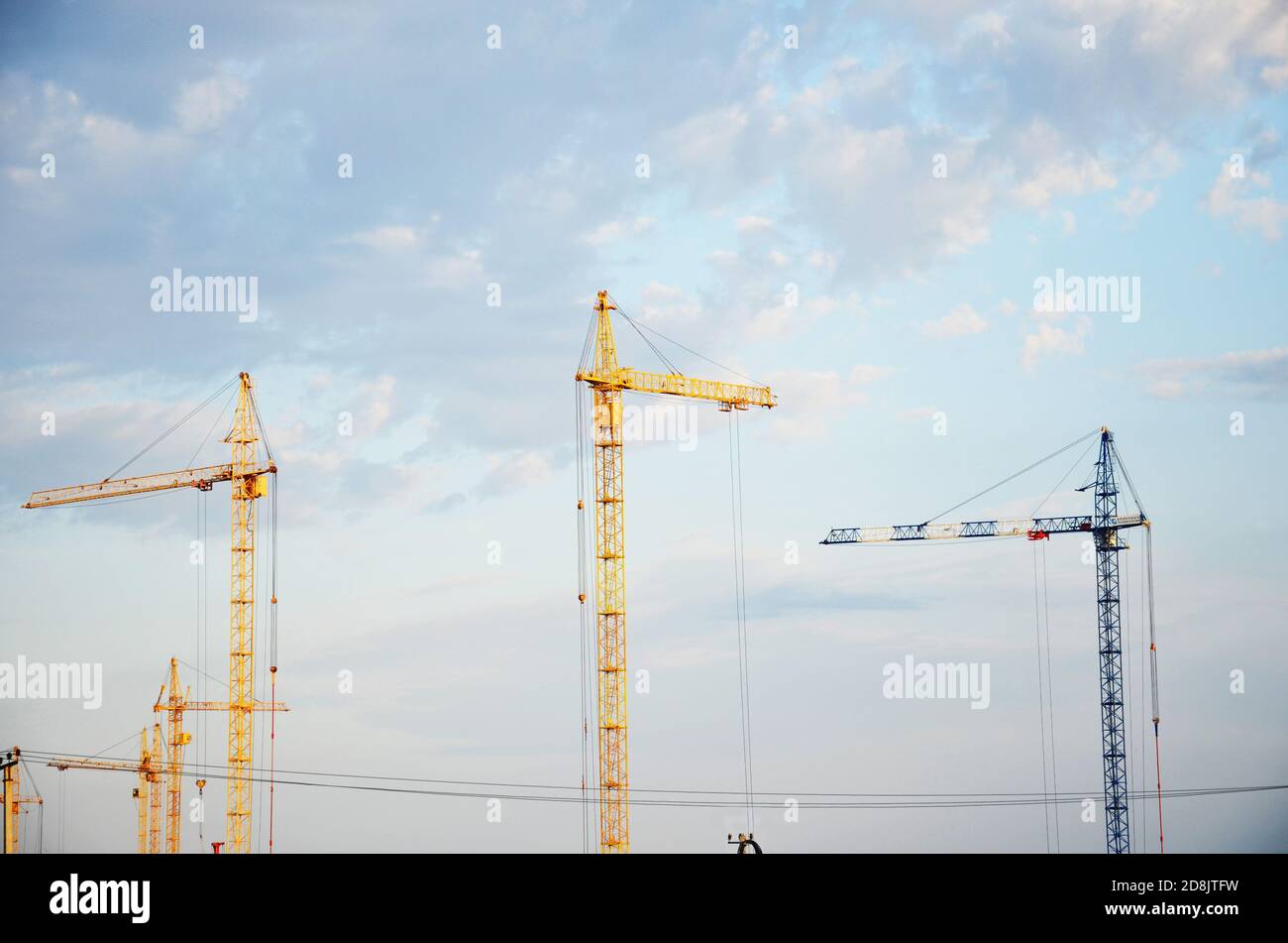 Inside place for many tall buildings under construction and cranes ...