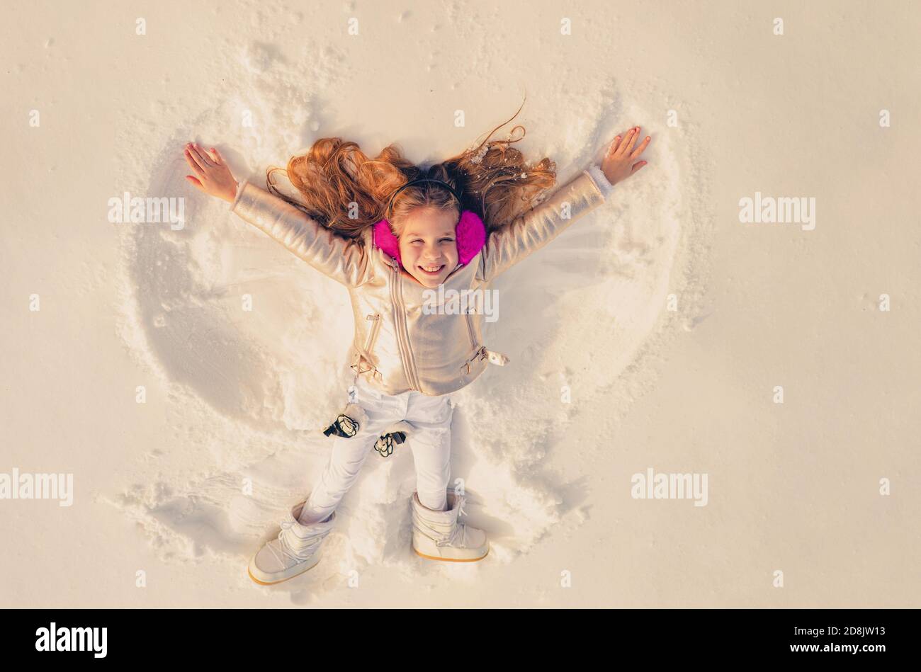 Children making snow angels hi-res stock photography and images - Alamy