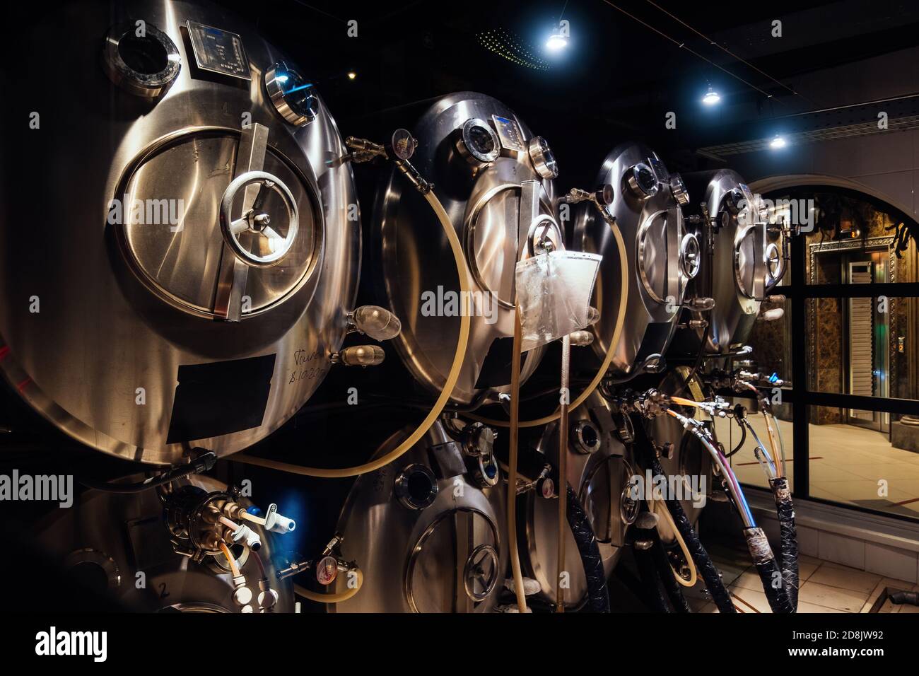 Beer kegs connected with pipes for beer serving at the bar in pub Stock ...