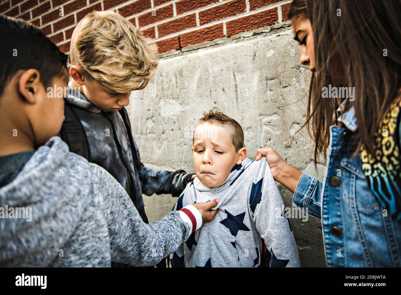 sad intimidation moment Elementary Age Bullying in Schoolyard Stock ...