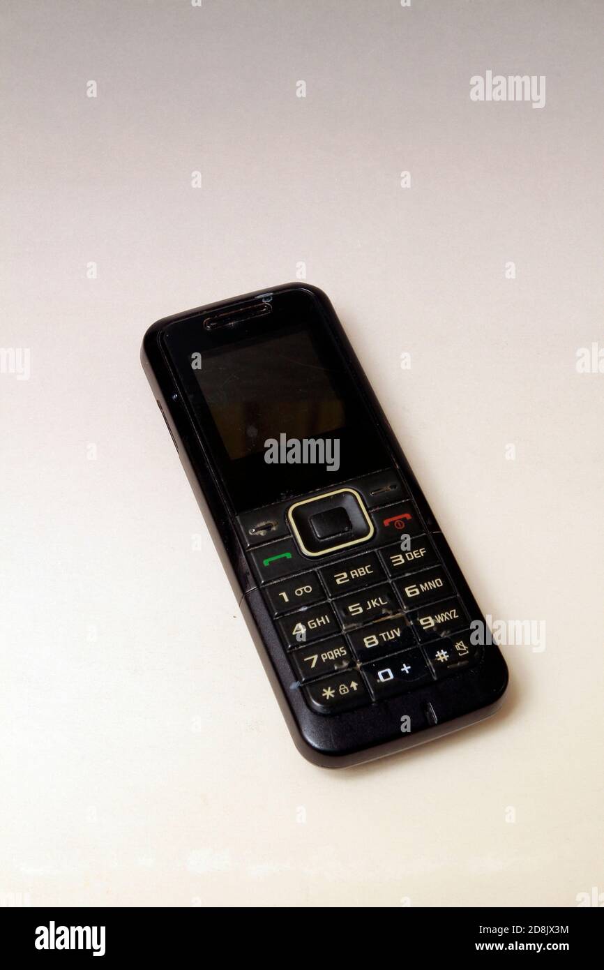 Close up of and old analogue mobile cell phone. Old fashioned black ...