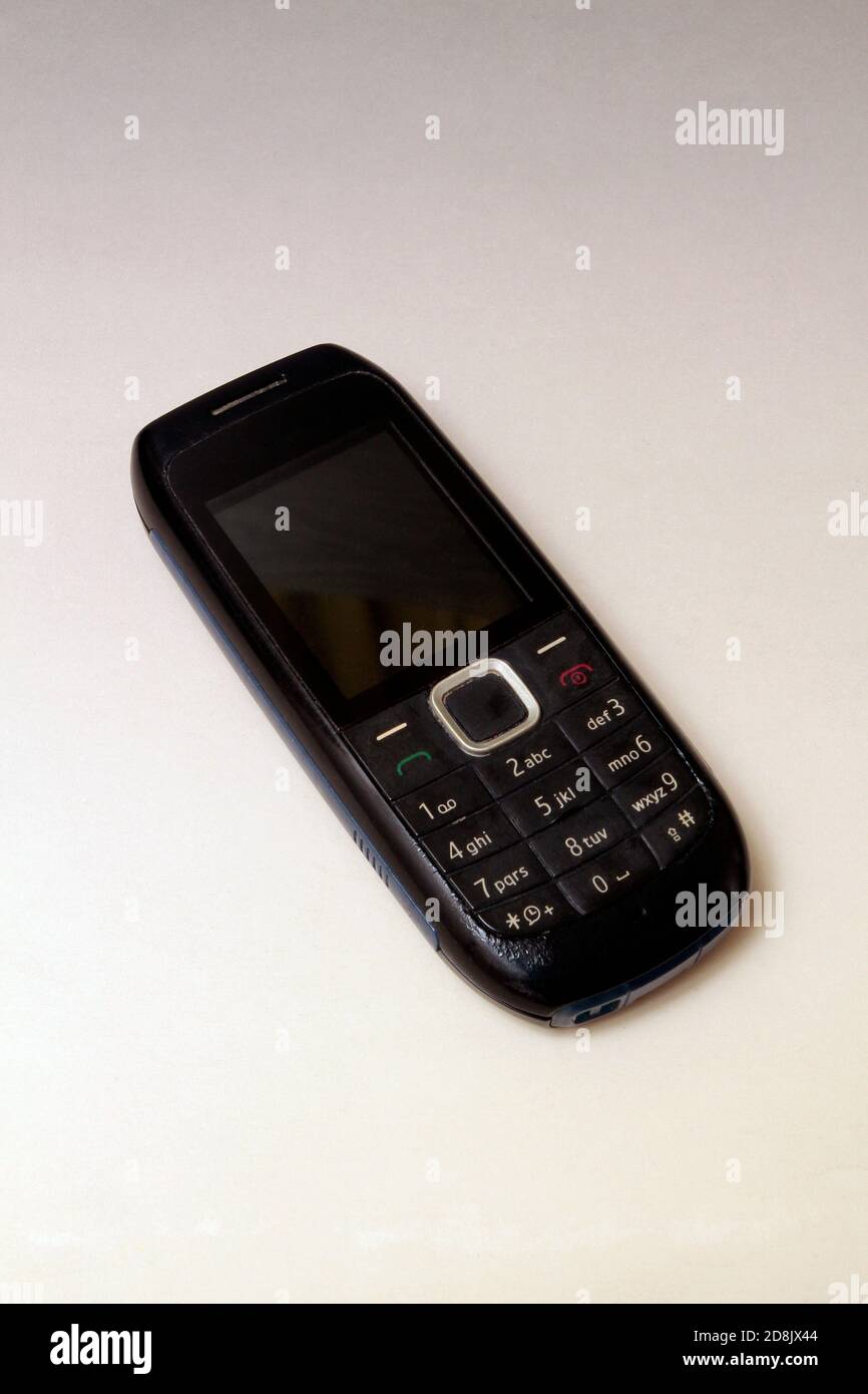 Close up of and old analogue mobile cell phone. Old fashioned black ...
