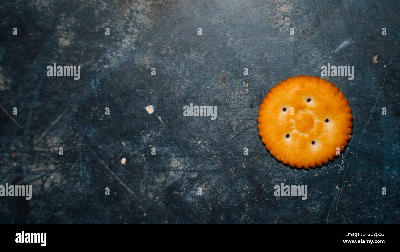 Flat lay of a blue table with a Cracker on it Stock Photo - Alamy