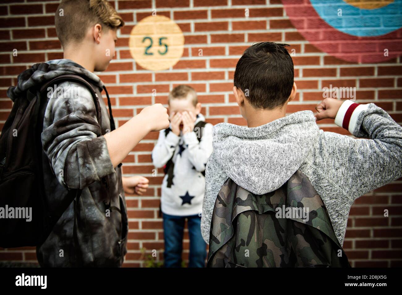 sad intimidation moment Elementary Age Bullying in Schoolyard Stock ...