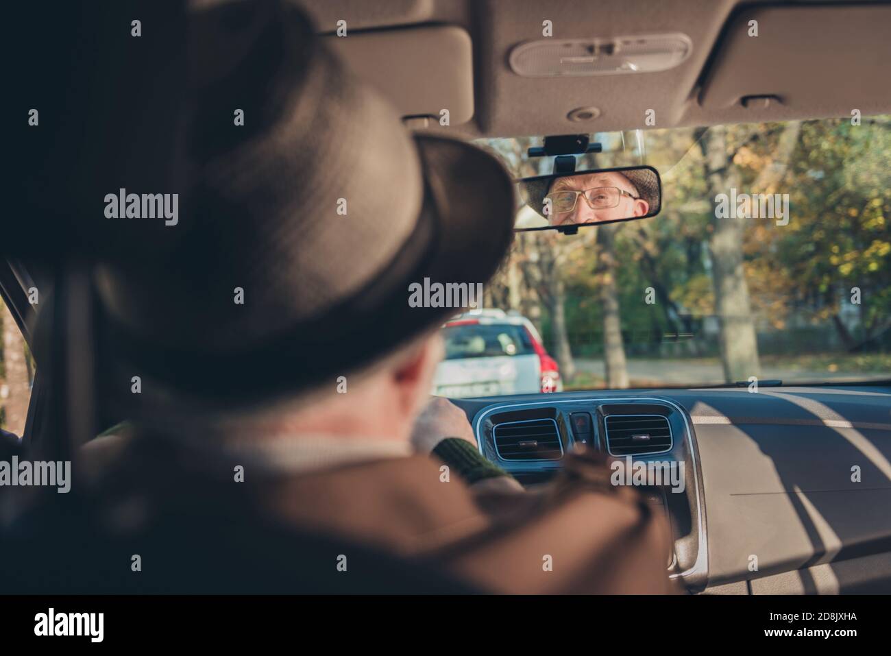 Photo of pensioner grandpa drive reflecting rare view mirror stuck jam ...