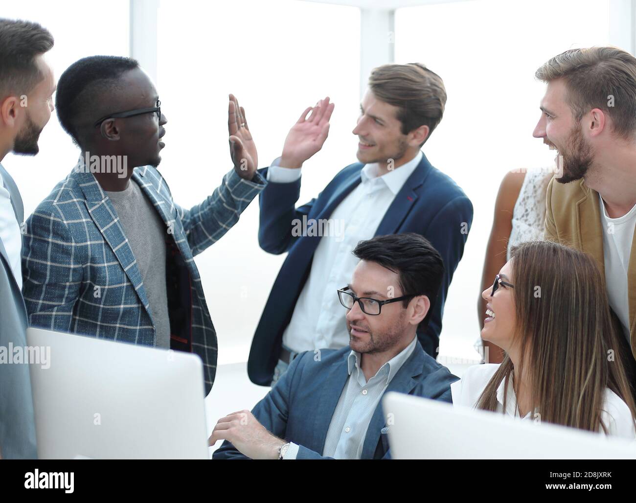 business team members giving each other high five Stock Photo - Alamy