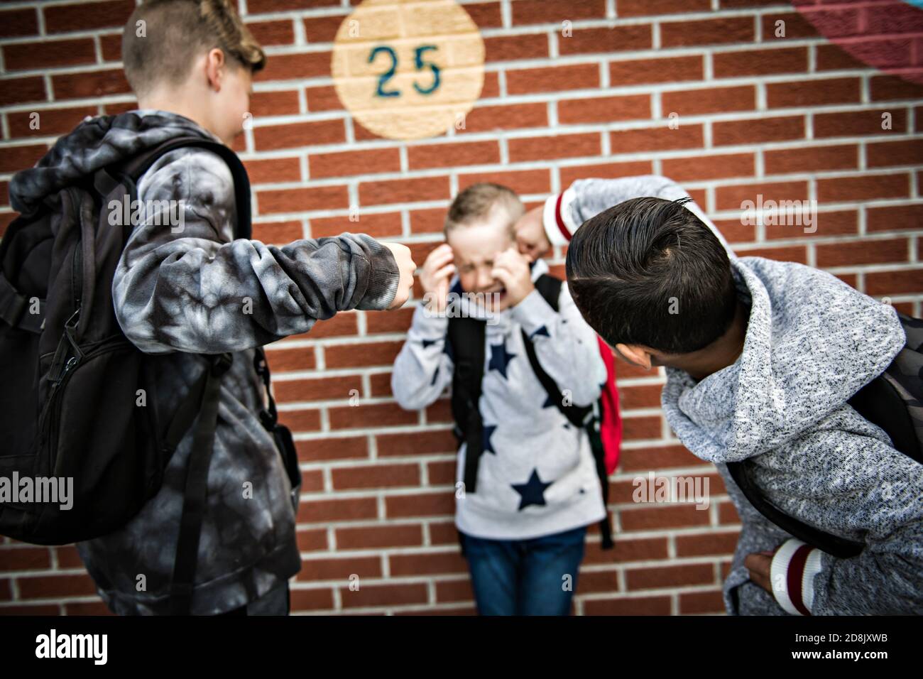 sad intimidation moment Elementary Age Bullying in Schoolyard Stock ...