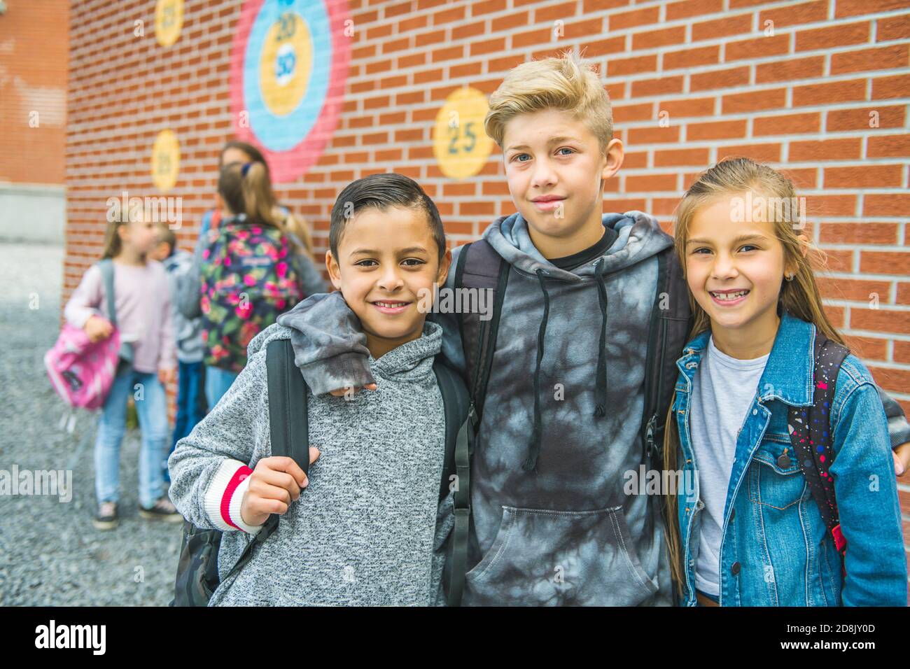 group of kids on the school background having fun Stock Photo - Alamy