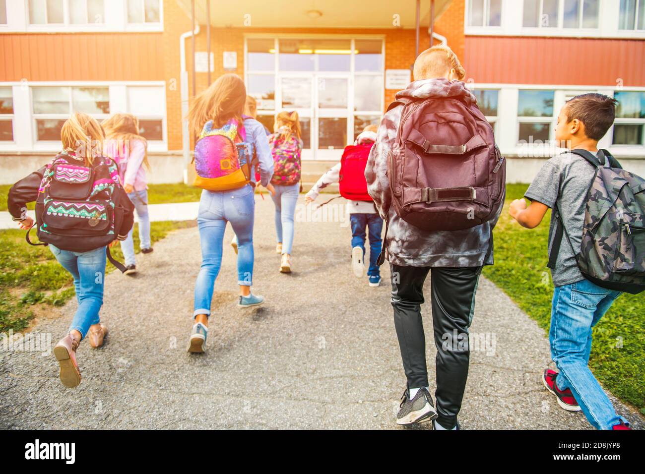group of kids go to the school, Back view Stock Photo - Alamy