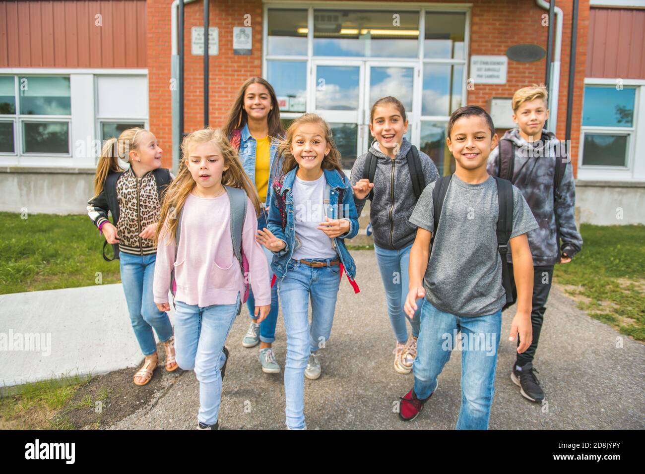 group of kids on the school background having fun Stock Photo - Alamy