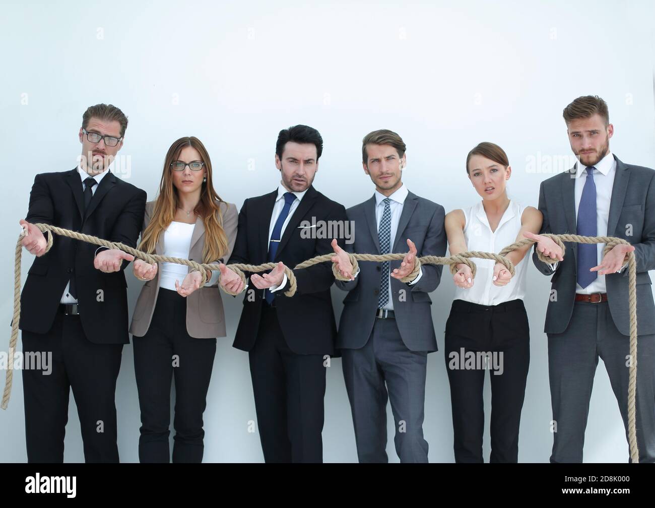 group of young people tied with a strong rope Stock Photo - Alamy