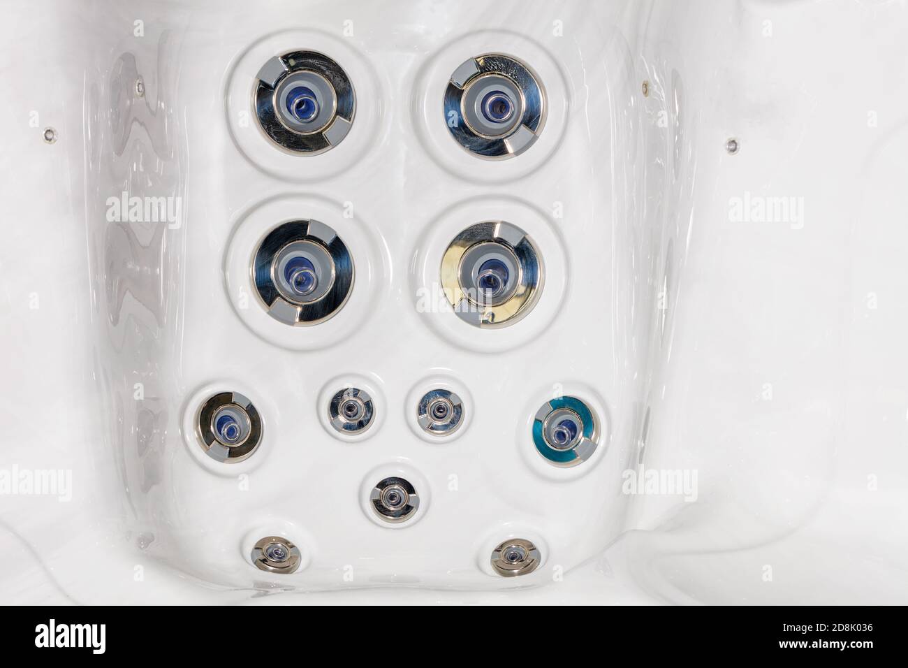 Large and small nozzles of a hydromassage system in a jacuzzi spa ...