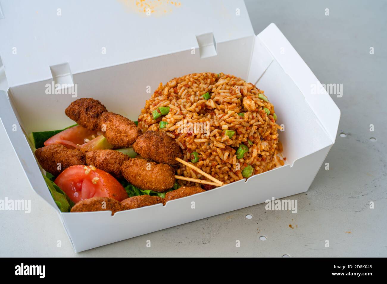 Cardboard boxes with hot rice to go. Food delivery Stock Photo - Alamy