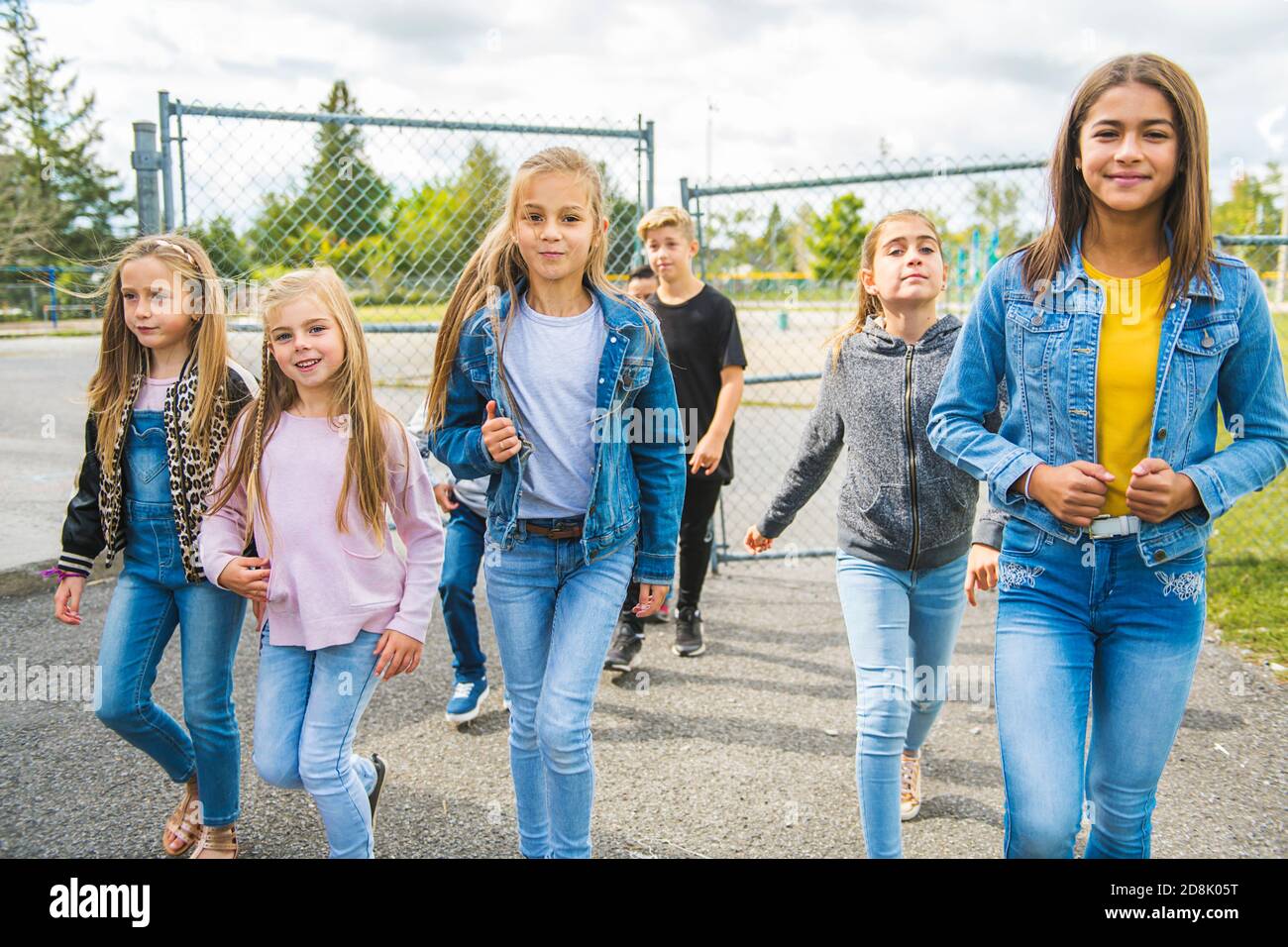 Some nice kids on the school background on day time Stock Photo - Alamy