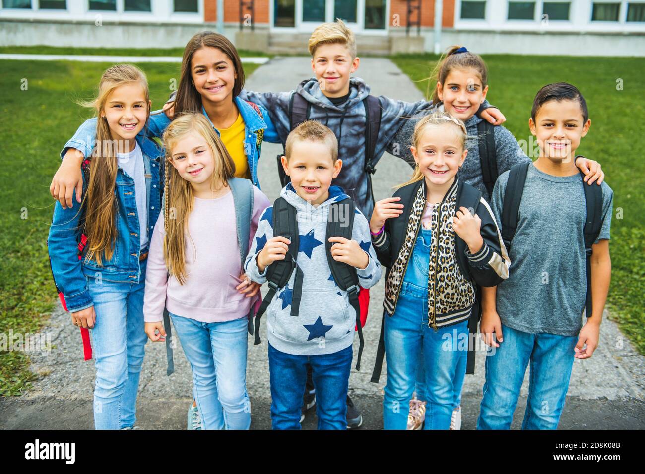 group of kids on the school background having fun Stock Photo - Alamy