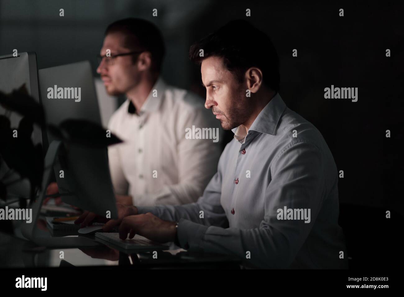 close up.employee of the company working after hours Stock Photo - Alamy