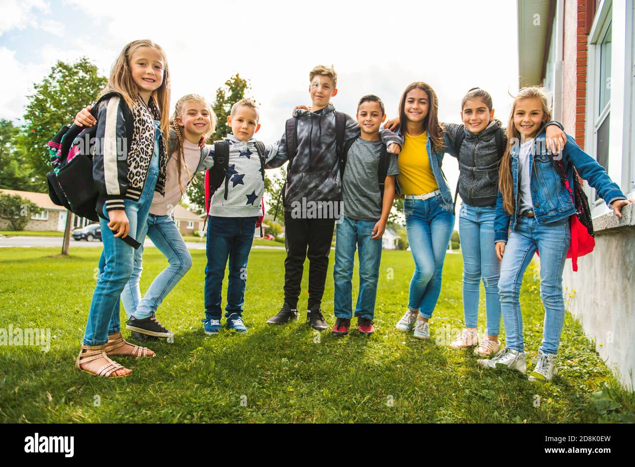 group of kids on the school background having fun Stock Photo - Alamy