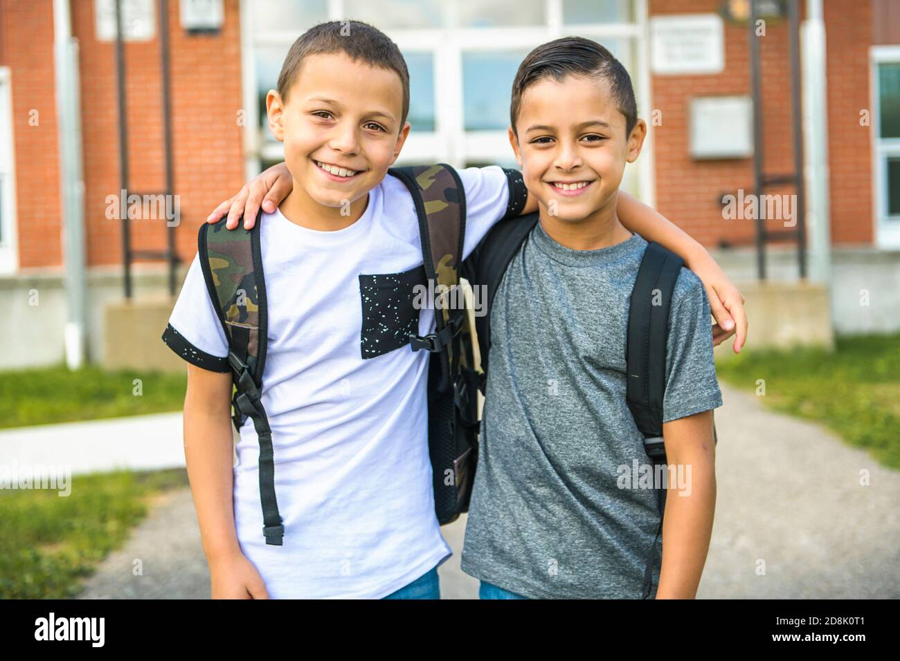 two kids friend on the school background having fun Stock Photo - Alamy