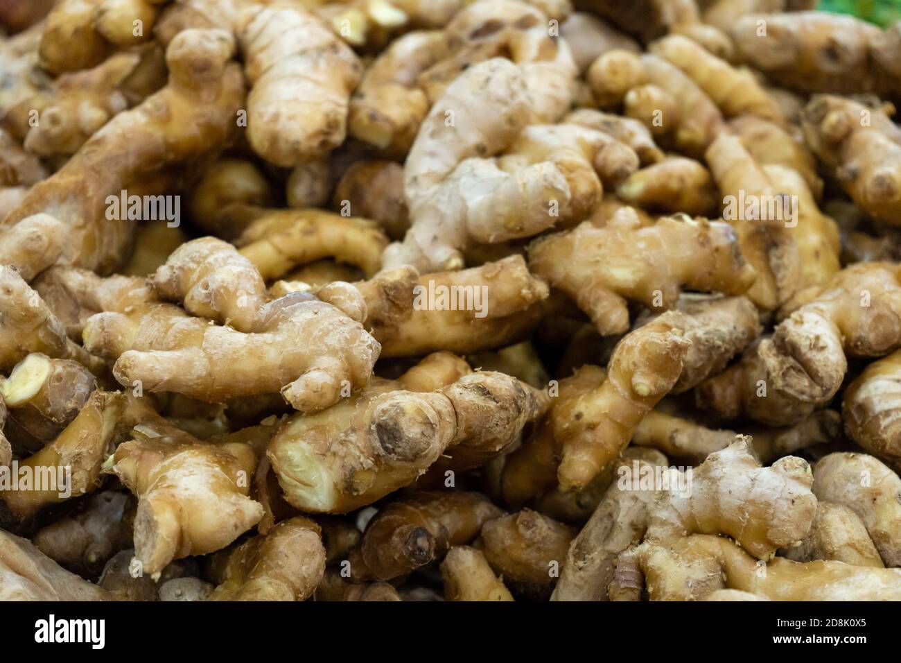 Ginger root counter at grocery store close up Stock Photo - Alamy