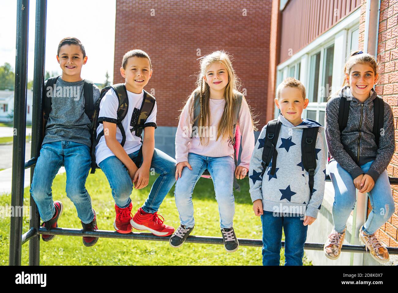 group of kids on the school background having fun Stock Photo - Alamy