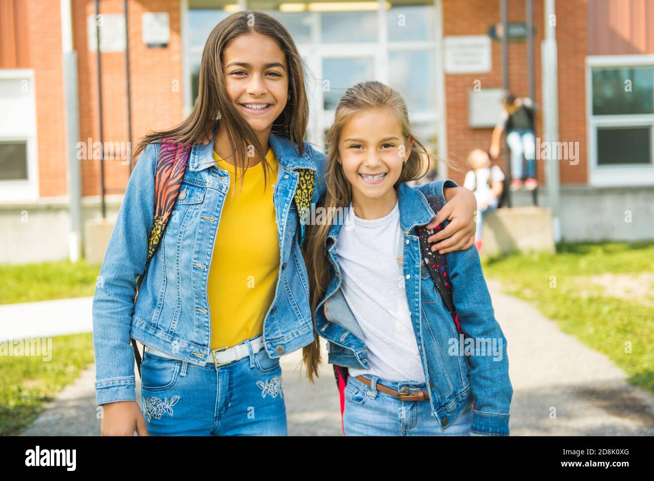 two kids friend on the school background having fun Stock Photo - Alamy