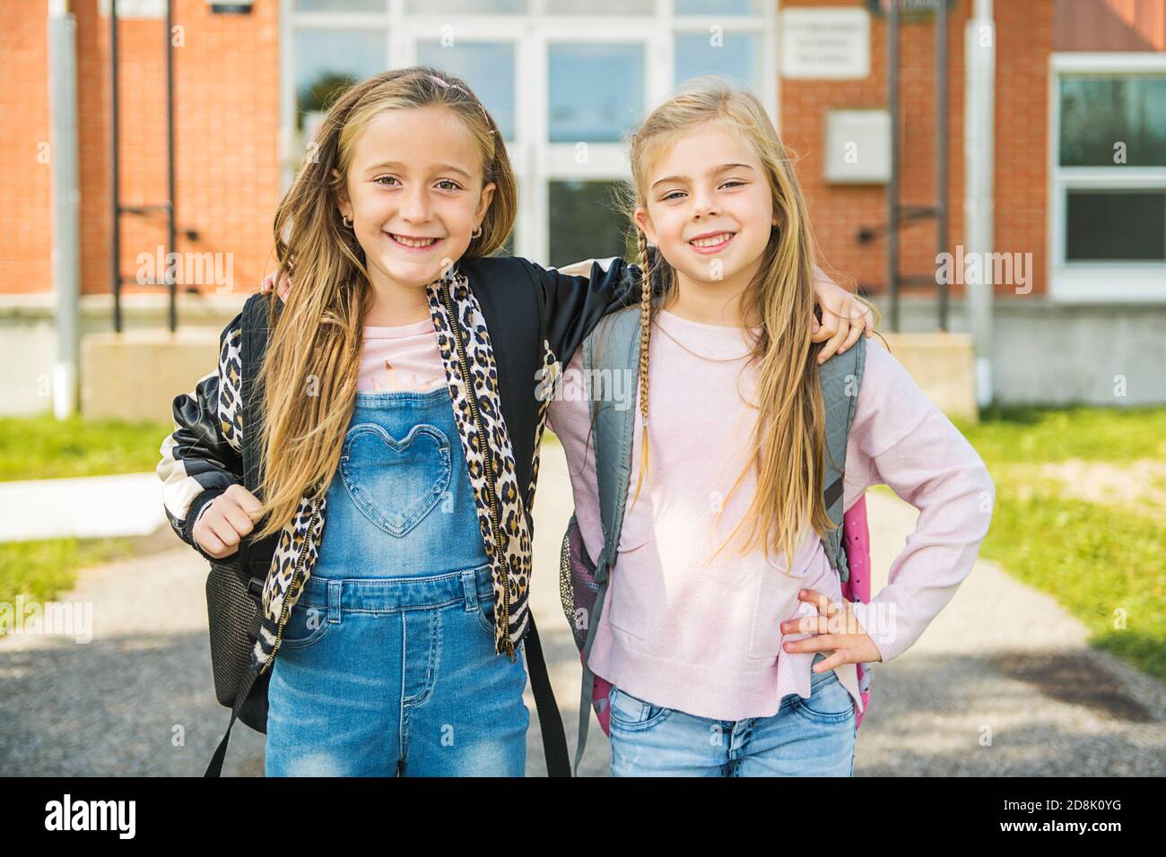 two kids friend on the school background having fun Stock Photo - Alamy