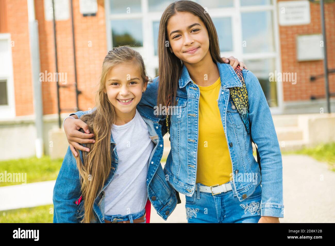 two kids friend on the school background having fun Stock Photo - Alamy