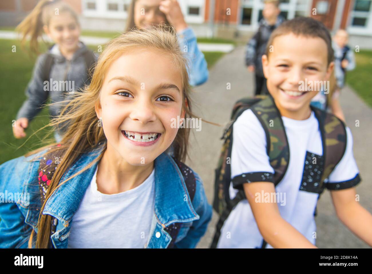 group of kids on the school background having fun Stock Photo - Alamy