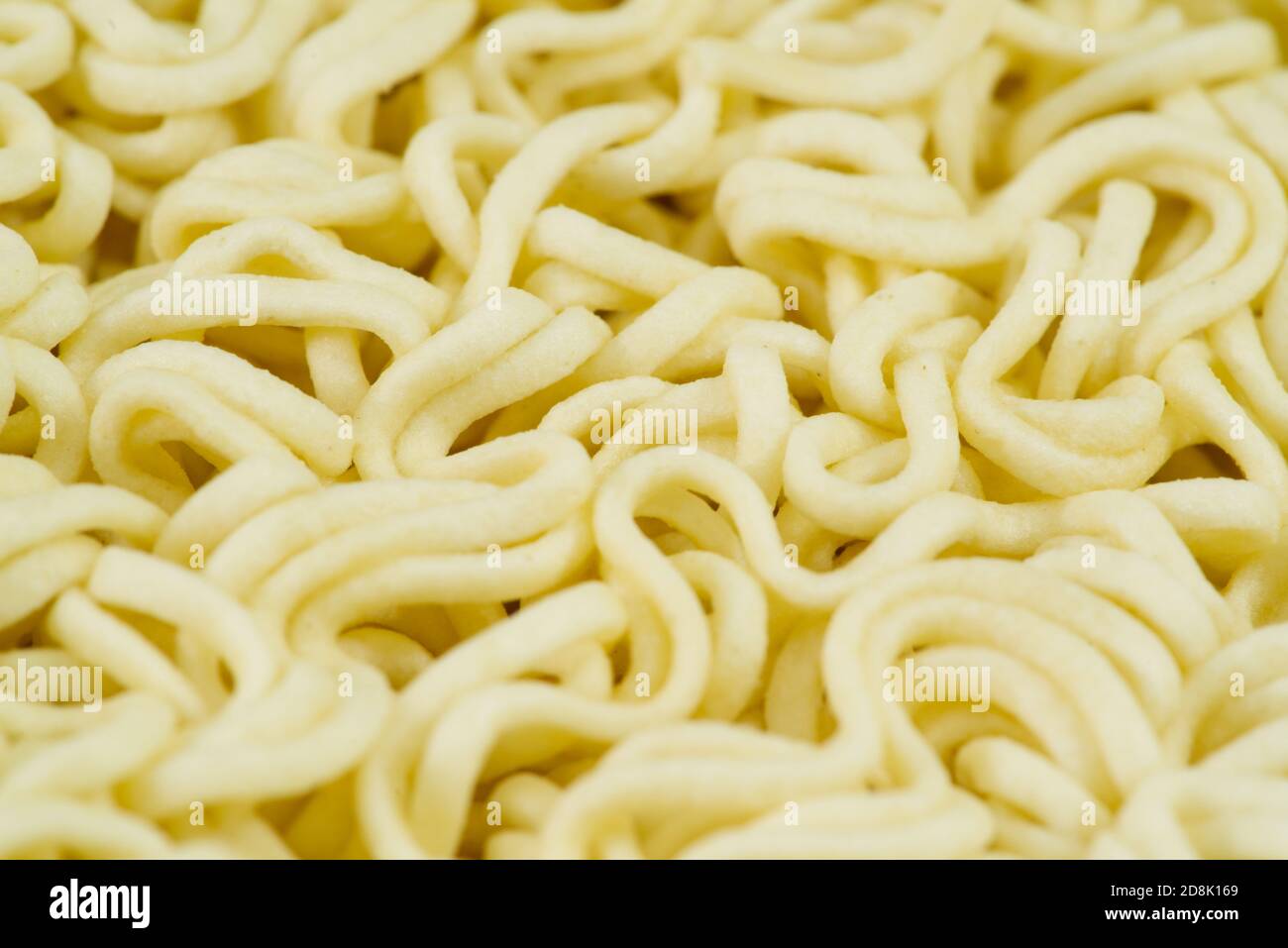 Full frame yellow Instant noodles for background Stock Photo - Alamy