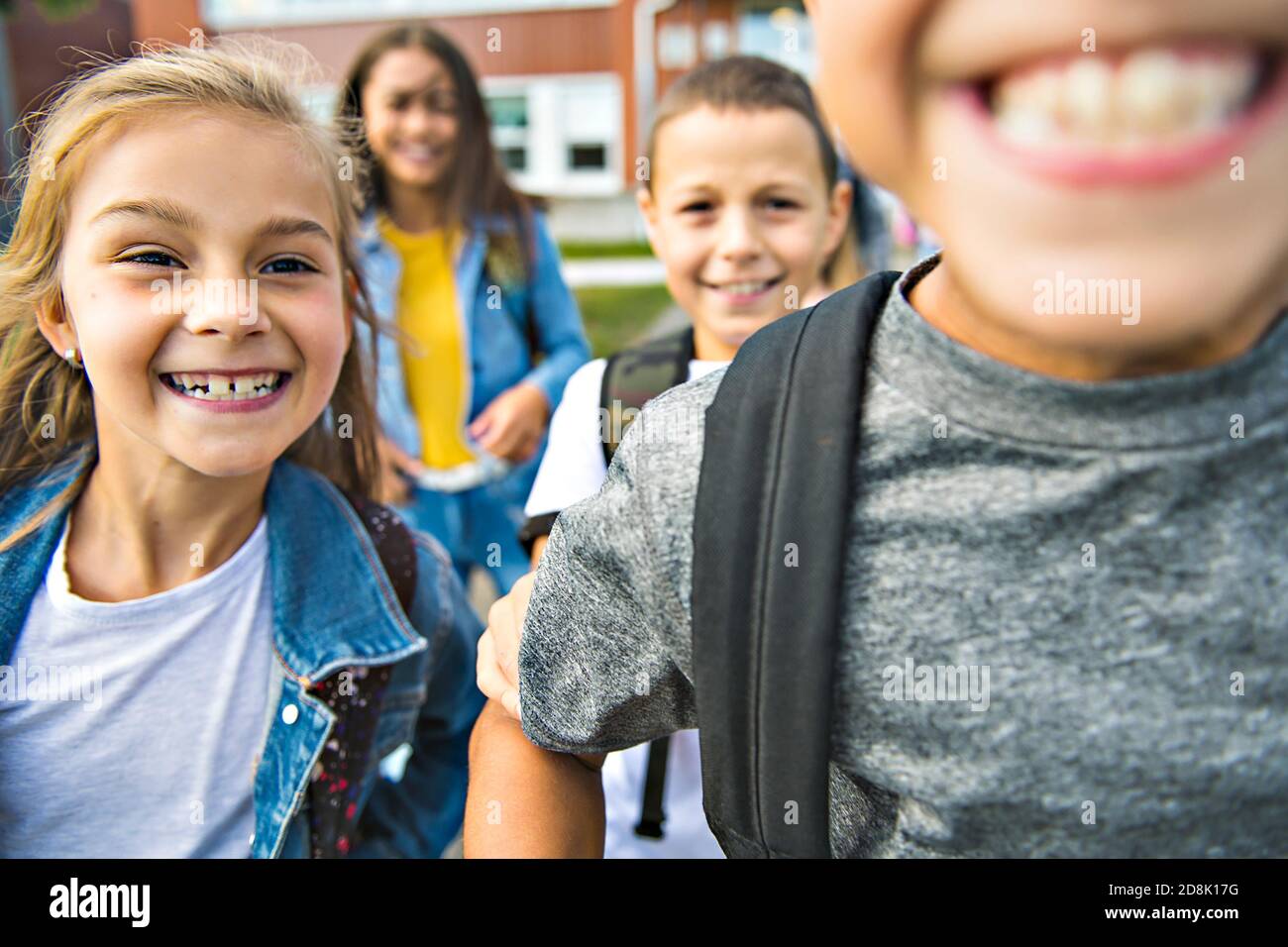 group of kids on the school background having fun Stock Photo - Alamy