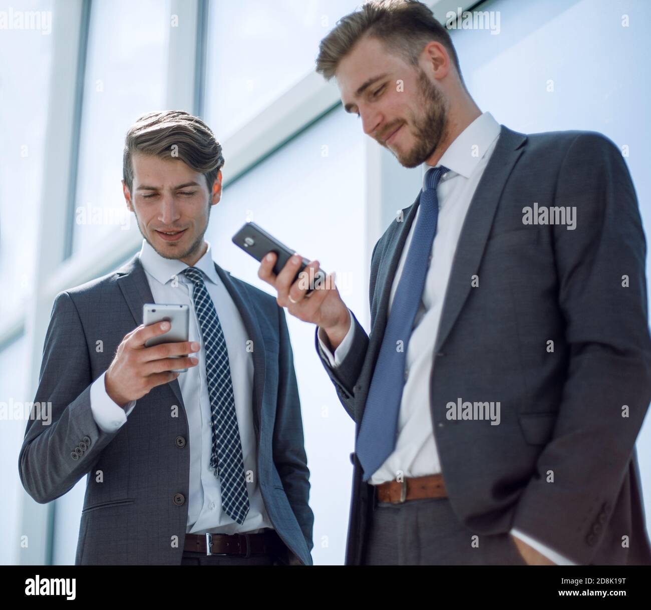 business colleagues talking outside the office window Stock Photo - Alamy