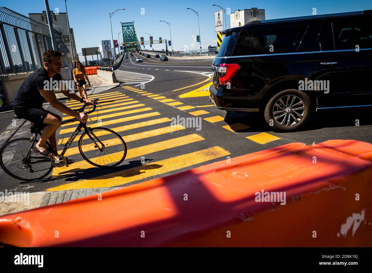Traffic at a zebra crossing (crosswalk) on the Jacques Cartier Bridge ...