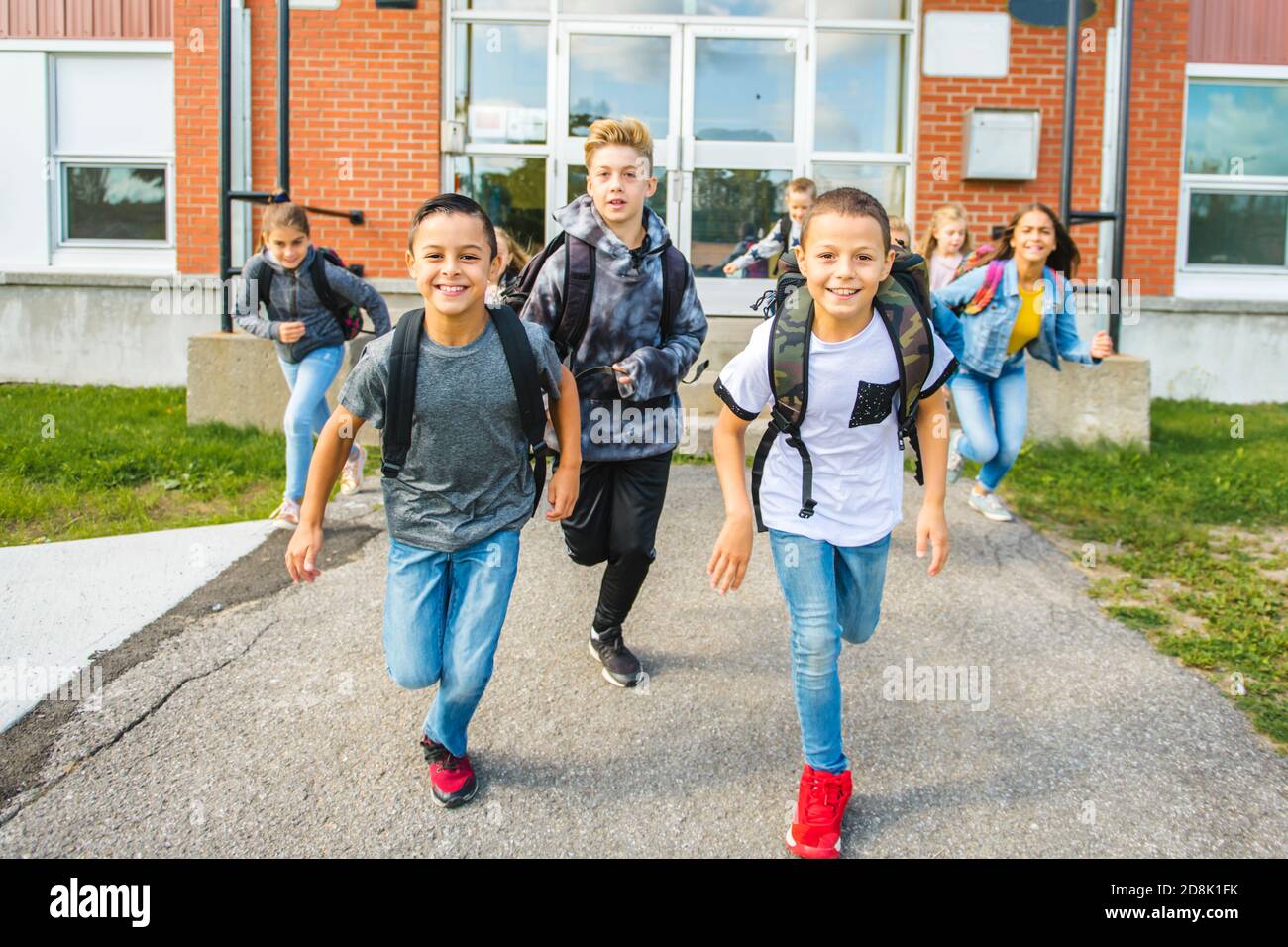 group of kids on the school background having fun Stock Photo - Alamy