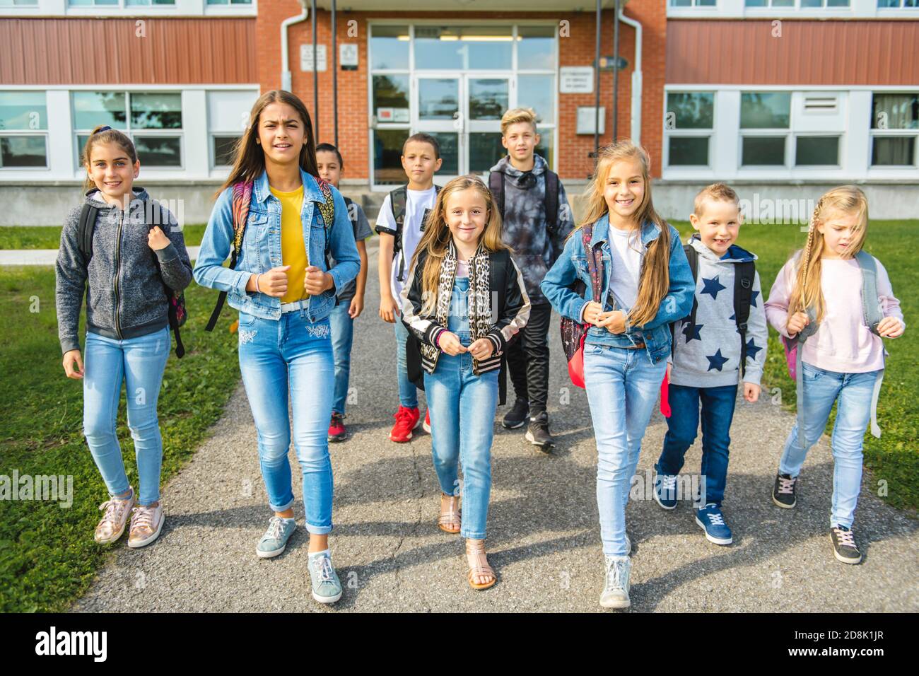 group of kids on the school background having fun Stock Photo - Alamy