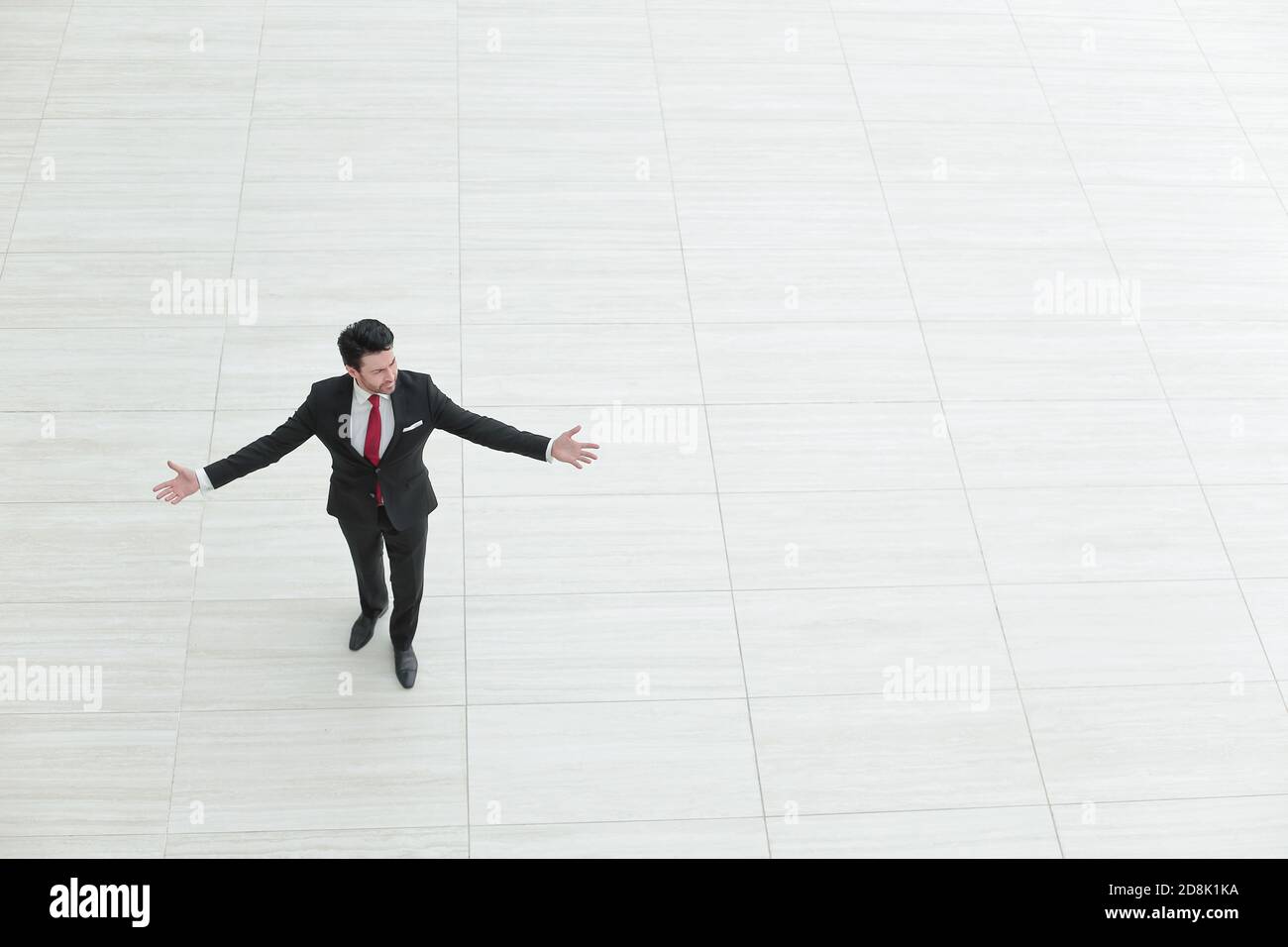 top view from afar.Businessman spreads his hands to the sides Stock ...