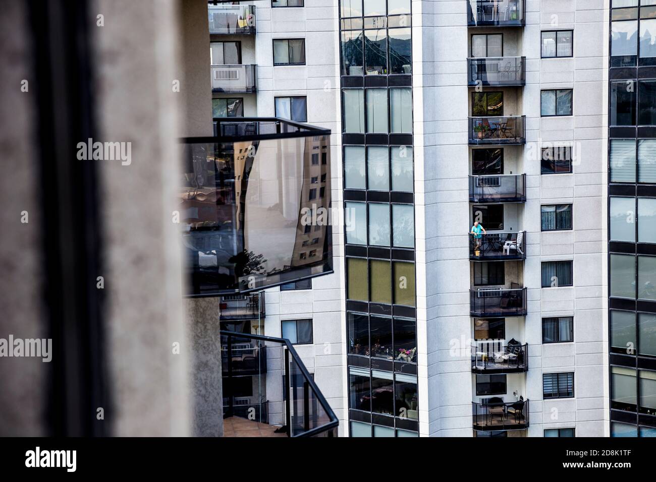 Man stand stands standing on balcony hi-res stock photography and ...