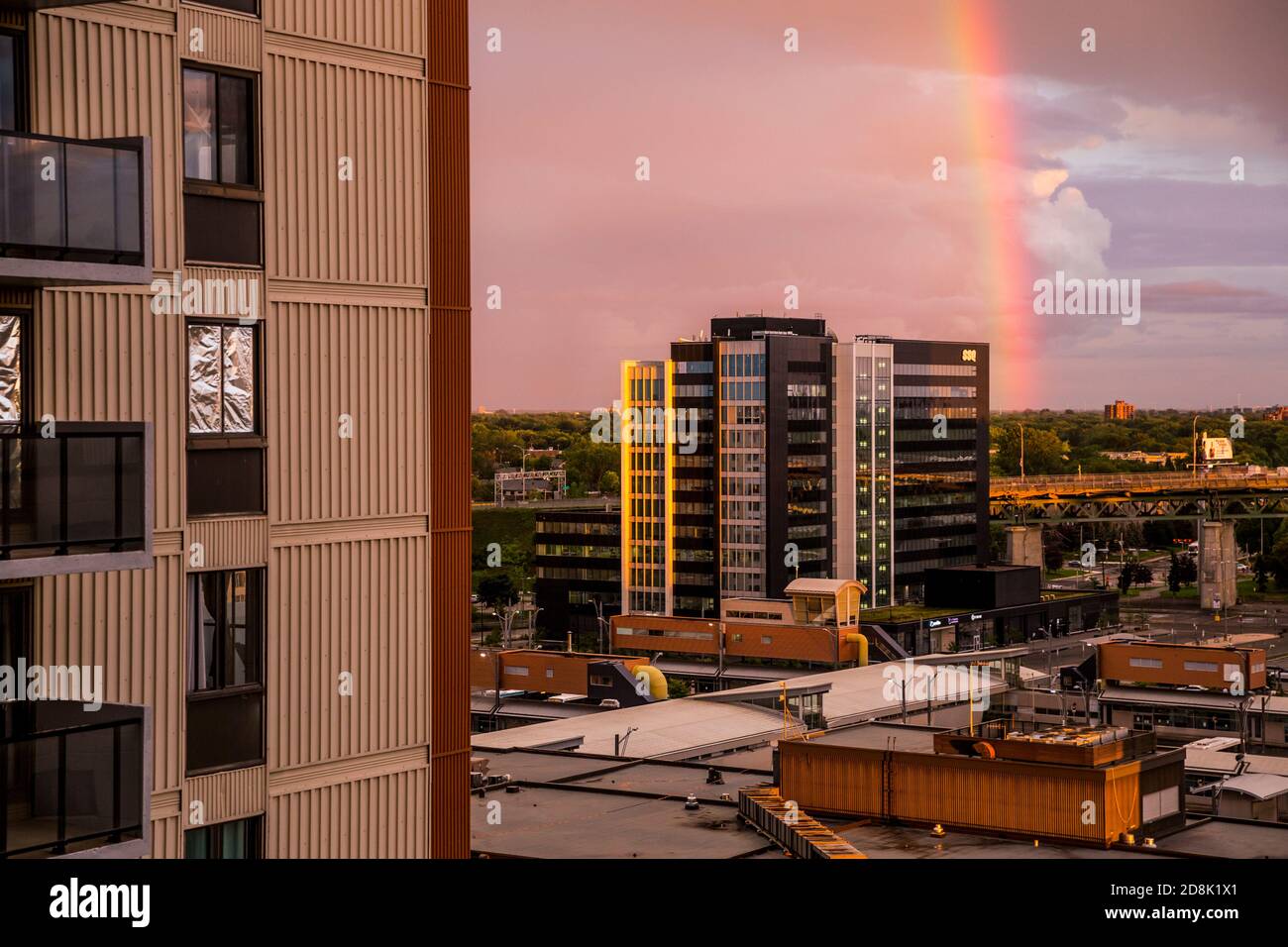 A rainbow over buildings in Longueuil, QC, Canada Stock Photo - Alamy